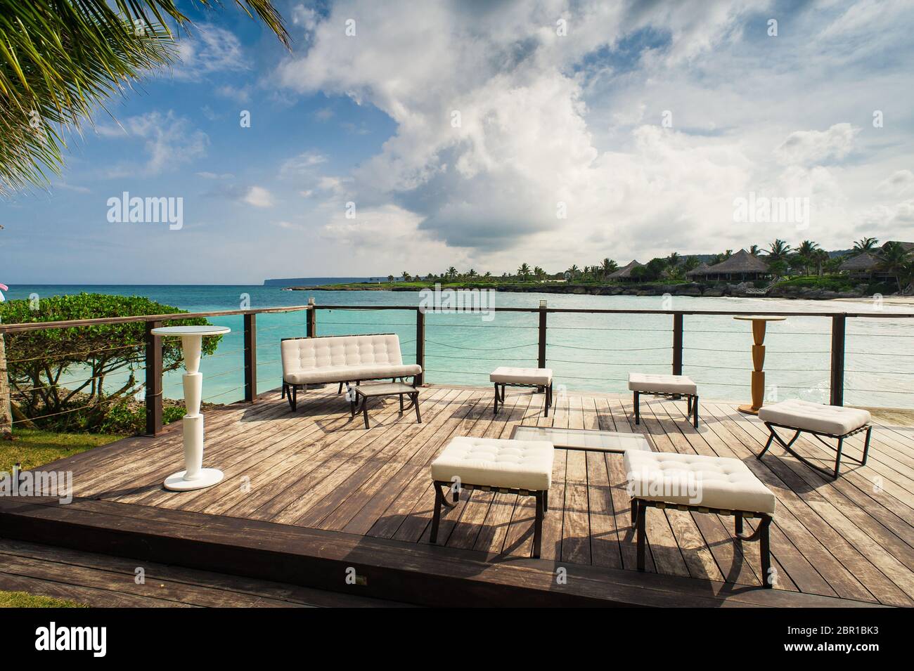 Outdoor restaurant at the beach. Cafe on the beach, ocean and sky ...
