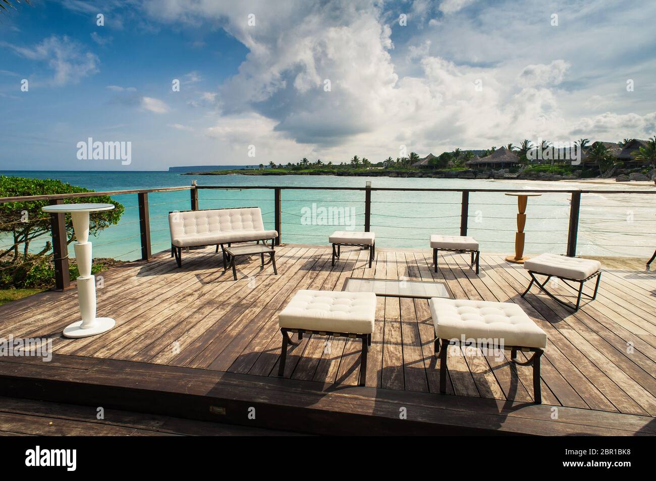 Outdoor restaurant at the beach. Cafe on the beach, ocean and sky ...