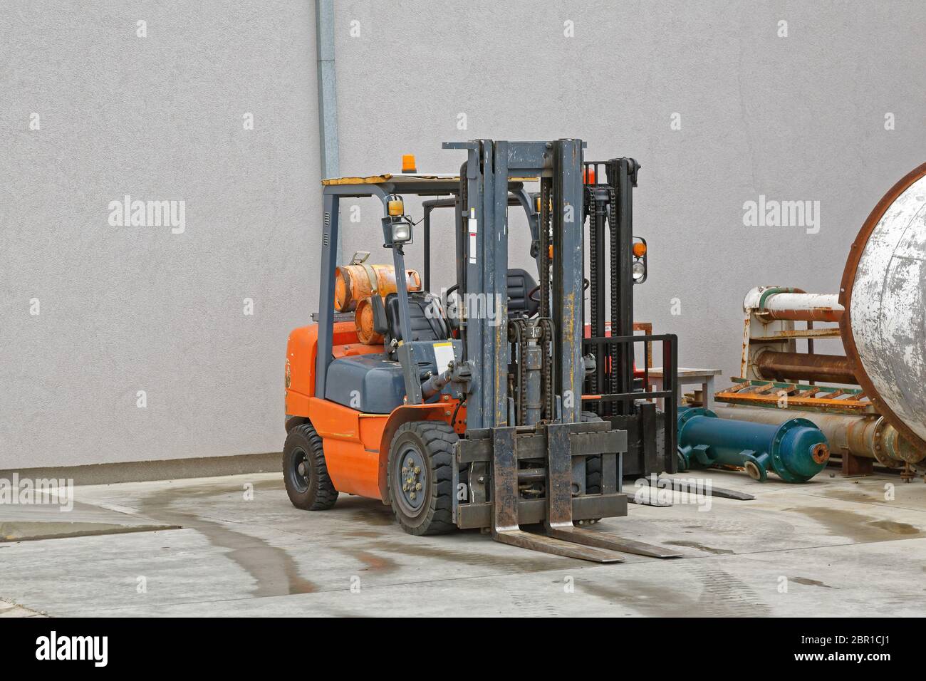 Gas Powered Forklift Truck in Front of Warehouse Stock Photo - Alamy