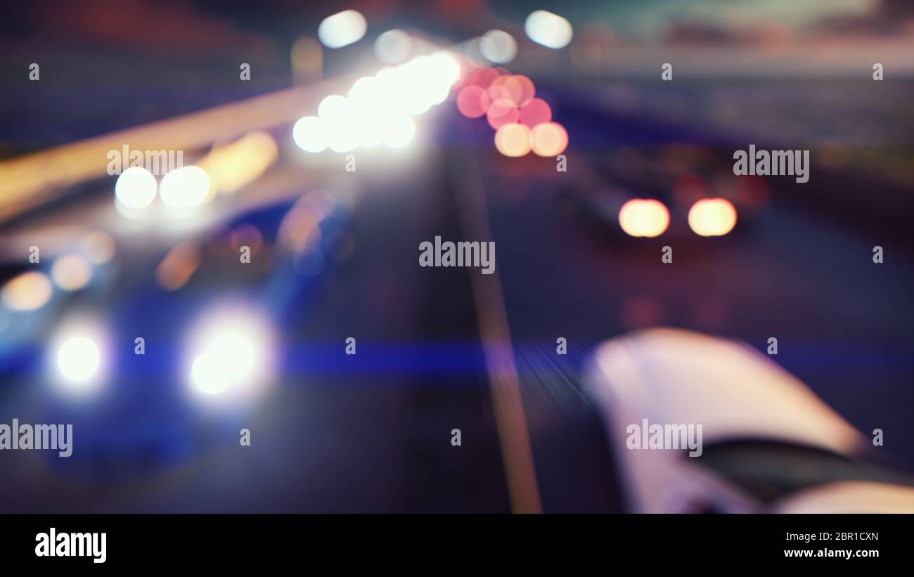 Defocused cars lights and background movement. Cars with lights on go ...