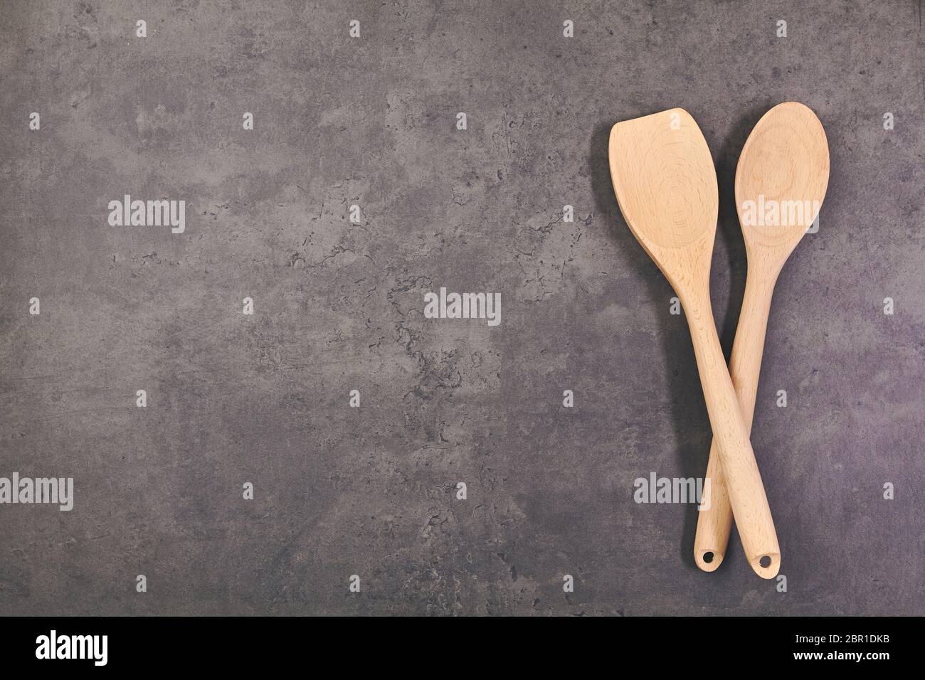 Wooden utensils over kitchen cooking table. Top view with copy space ...