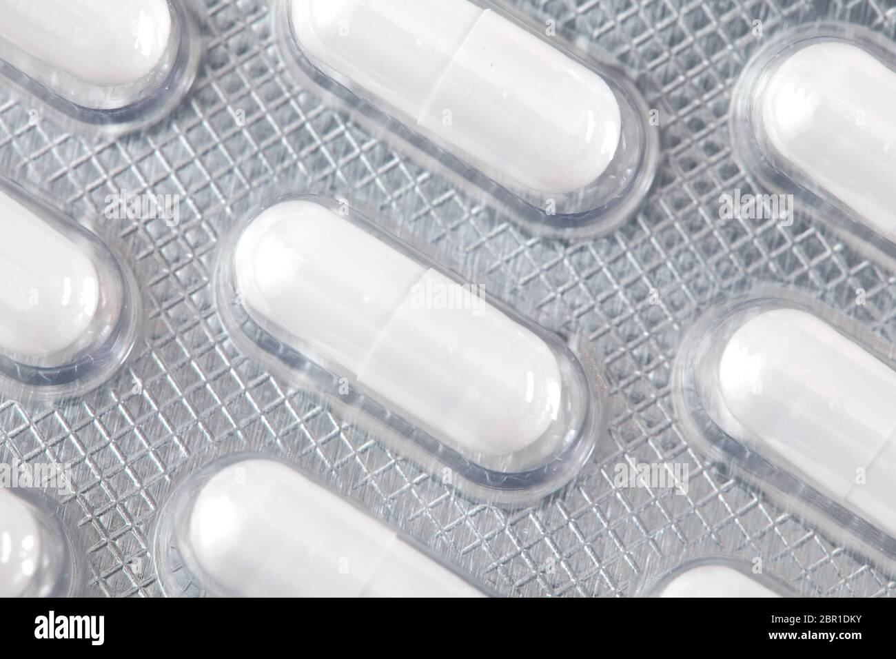White pills tablets in package. Pharmacy and medicine background Stock ...