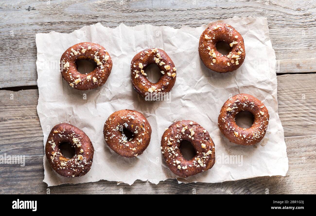 Donuts sprinkled with crushed nuts Stock Photo - Alamy