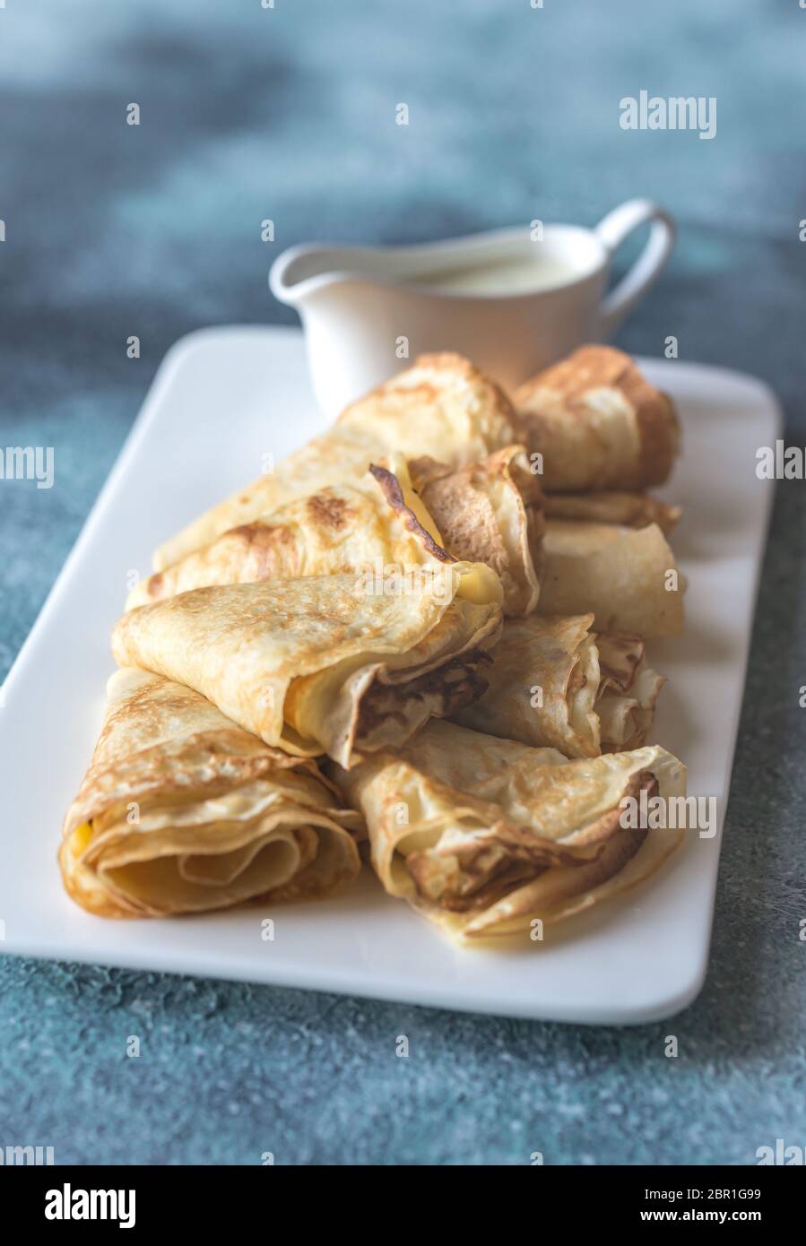 Crepes with blue cheese sauce Stock Photo - Alamy
