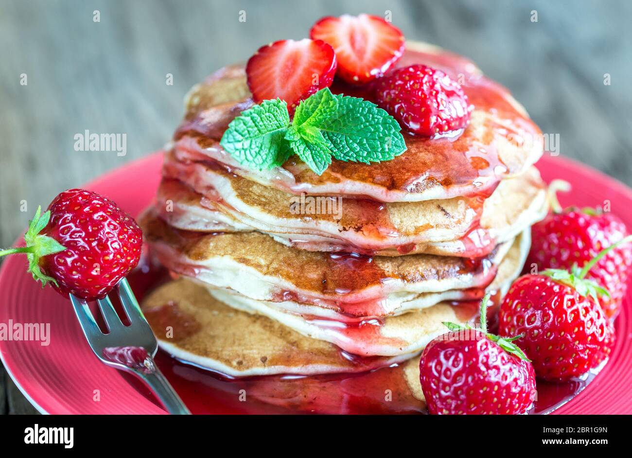 Pancakes with strawberry jam Stock Photo - Alamy