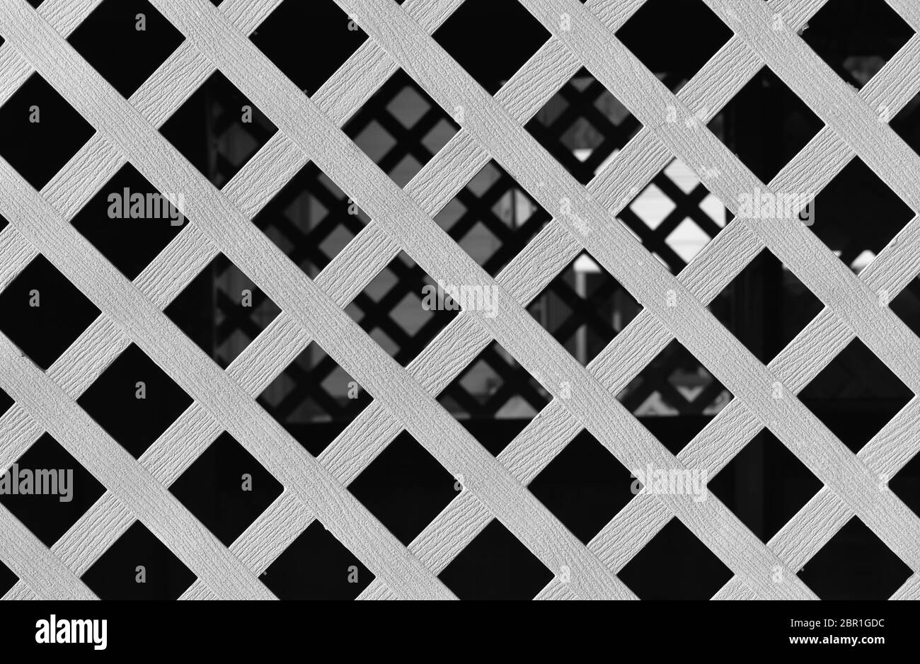 Isolated closeup of abstract lattice pattern with layered darkness and ...