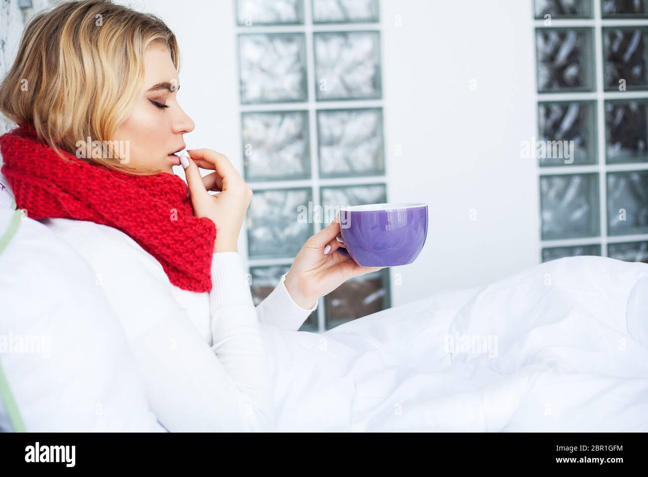 Flu. Woman Suffering From Cold Lying In Bed Stock Photo - Alamy