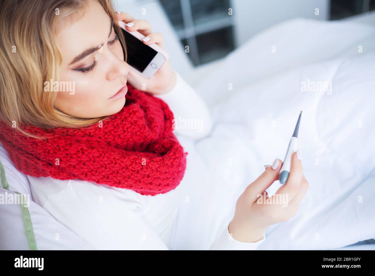 Flu. Woman Suffering From Cold Lying In Bed Stock Photo - Alamy