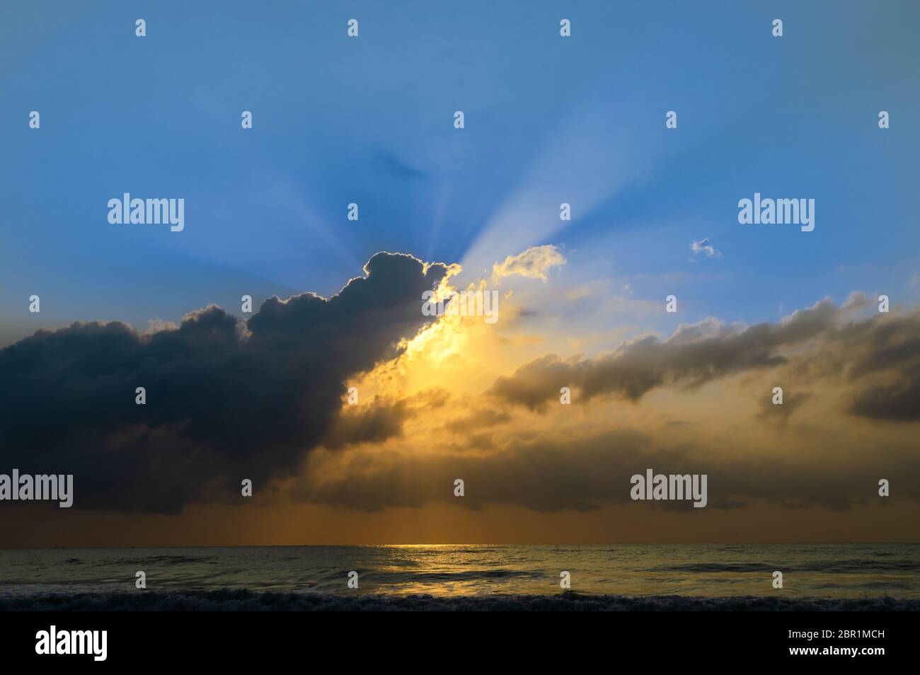 Nature view of sunrise beams over the tropical sea beach Stock Photo ...