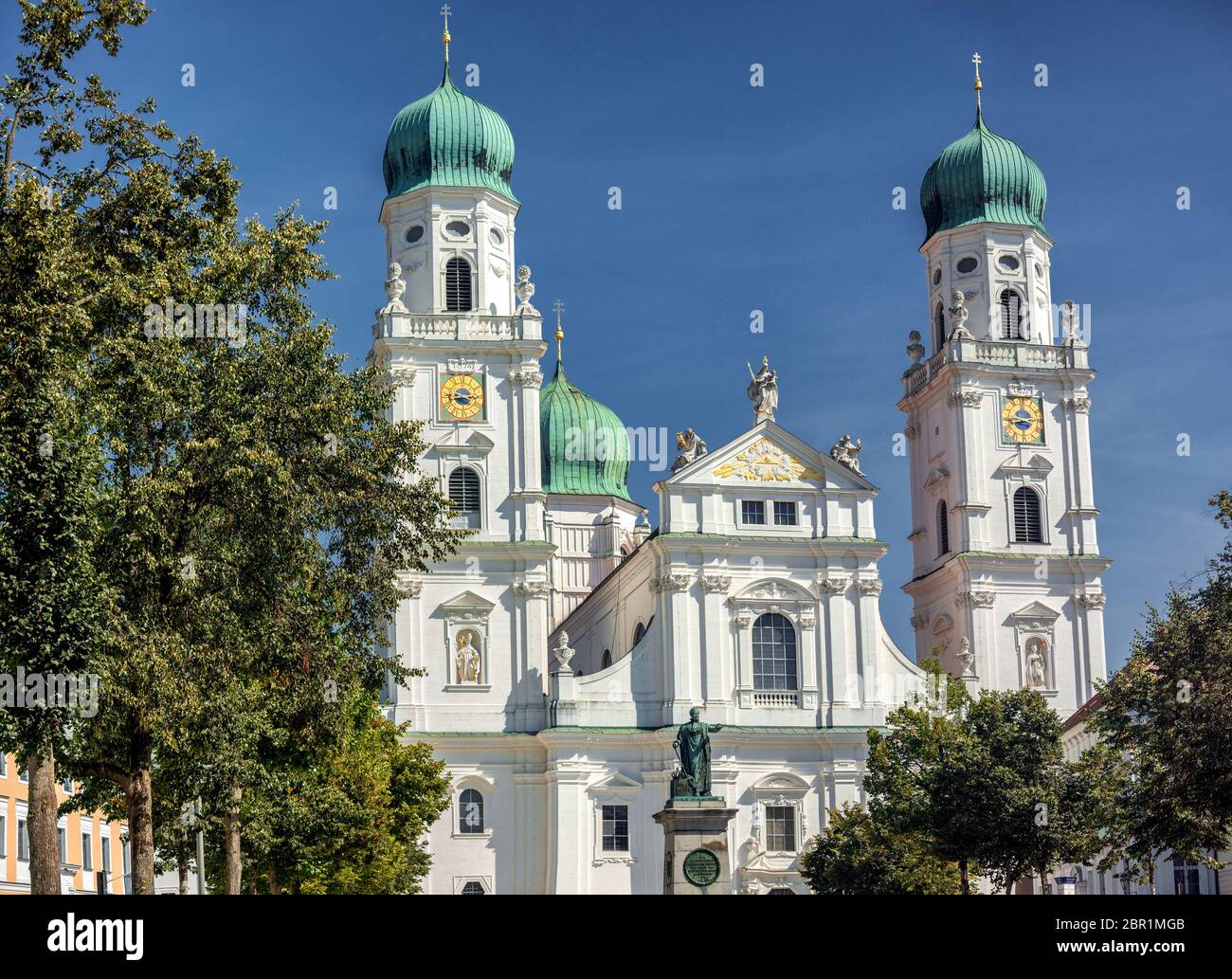 St. Stephens Basilica is an old white church with green metal domes on ...