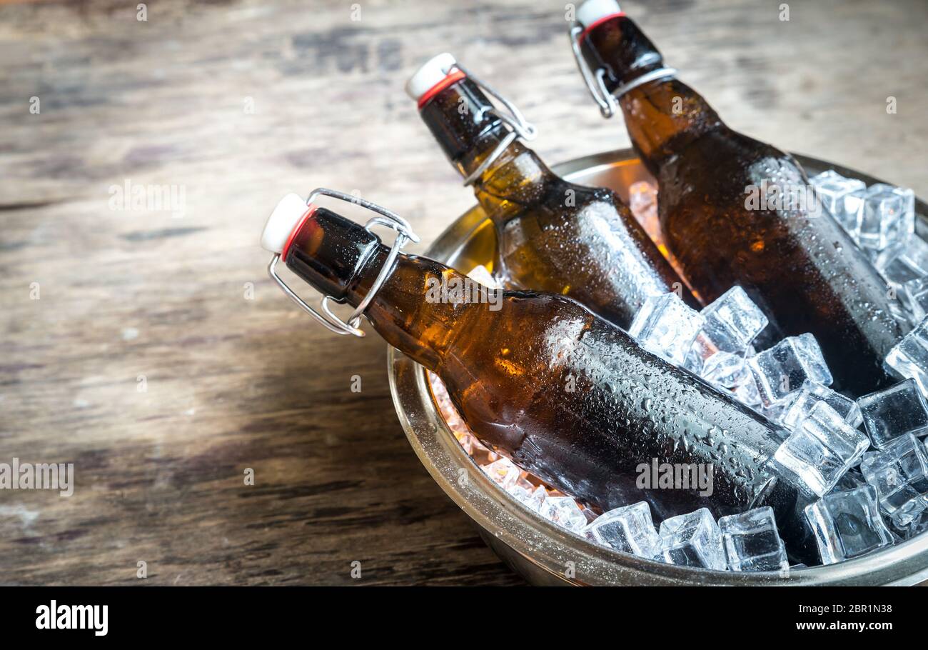 Bottles of beer in ice cubes Stock Photo - Alamy