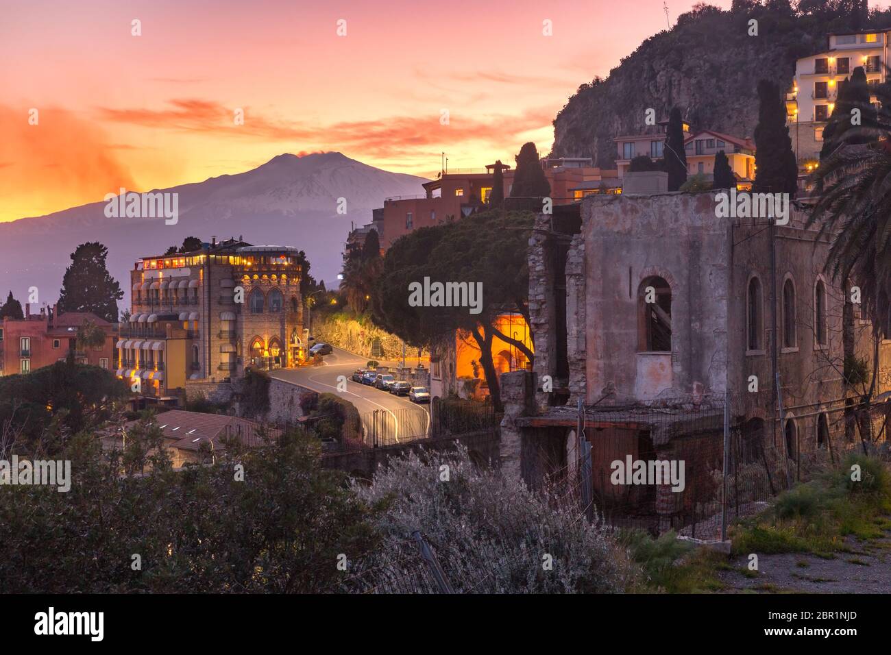 Mount Etna volcano at sunset, as seen from Taormina, Sicily Stock Photo ...
