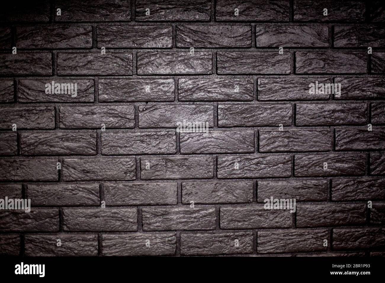 Dark brick wall background. Wall in modern office Stock Photo - Alamy