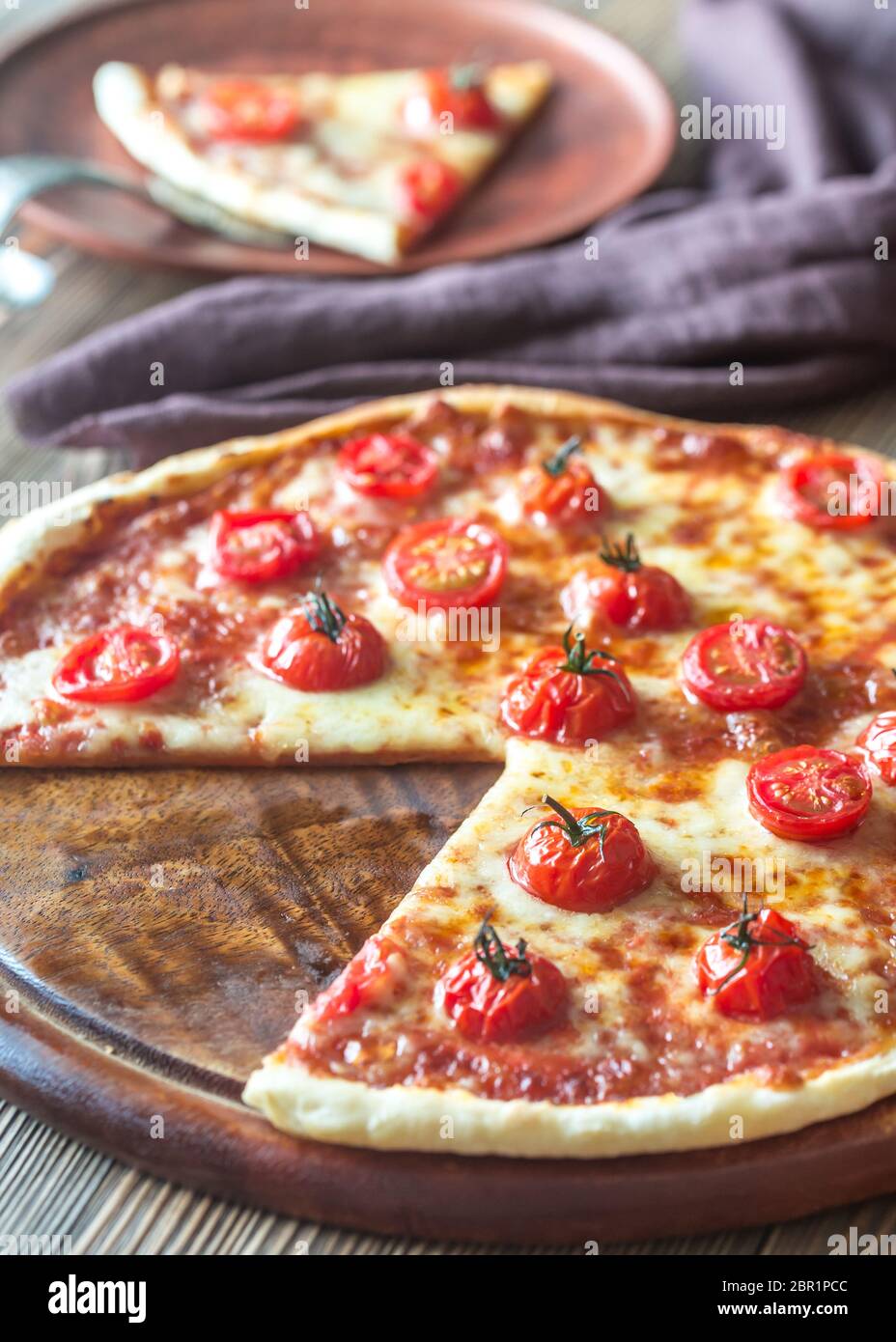 Pizza with cherry tomatoes and mozzarella Stock Photo - Alamy
