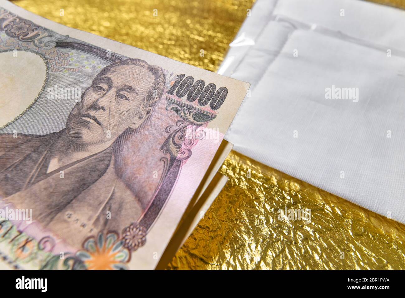 tokyo, japan - may 20 2020: Cloth masks and 100,000 yen in cash sent by ...