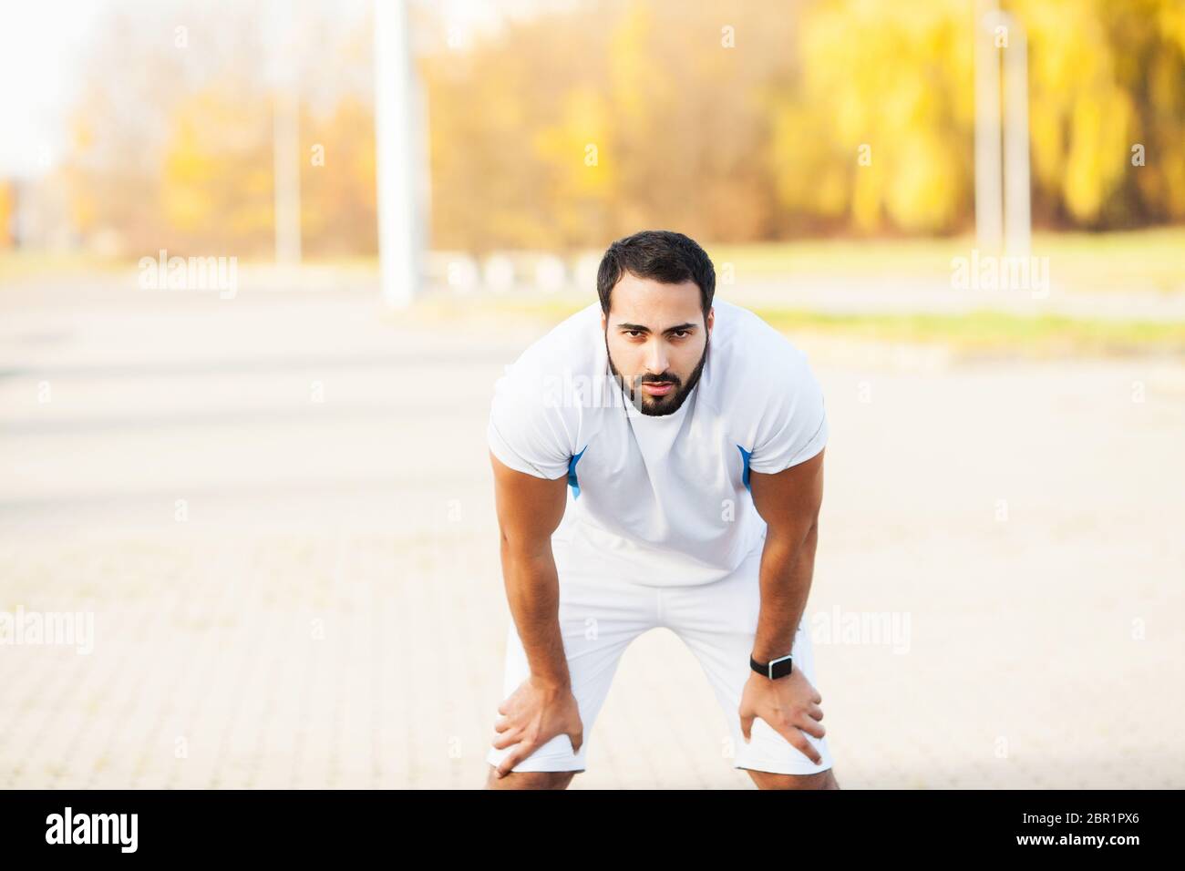 Fitness. Stretch man doing stretching exercise. Standing forward bend ...