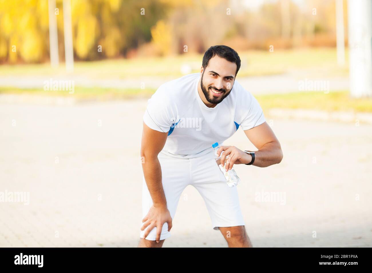 Fitness. Stretch man doing stretching exercise. Standing forward bend ...