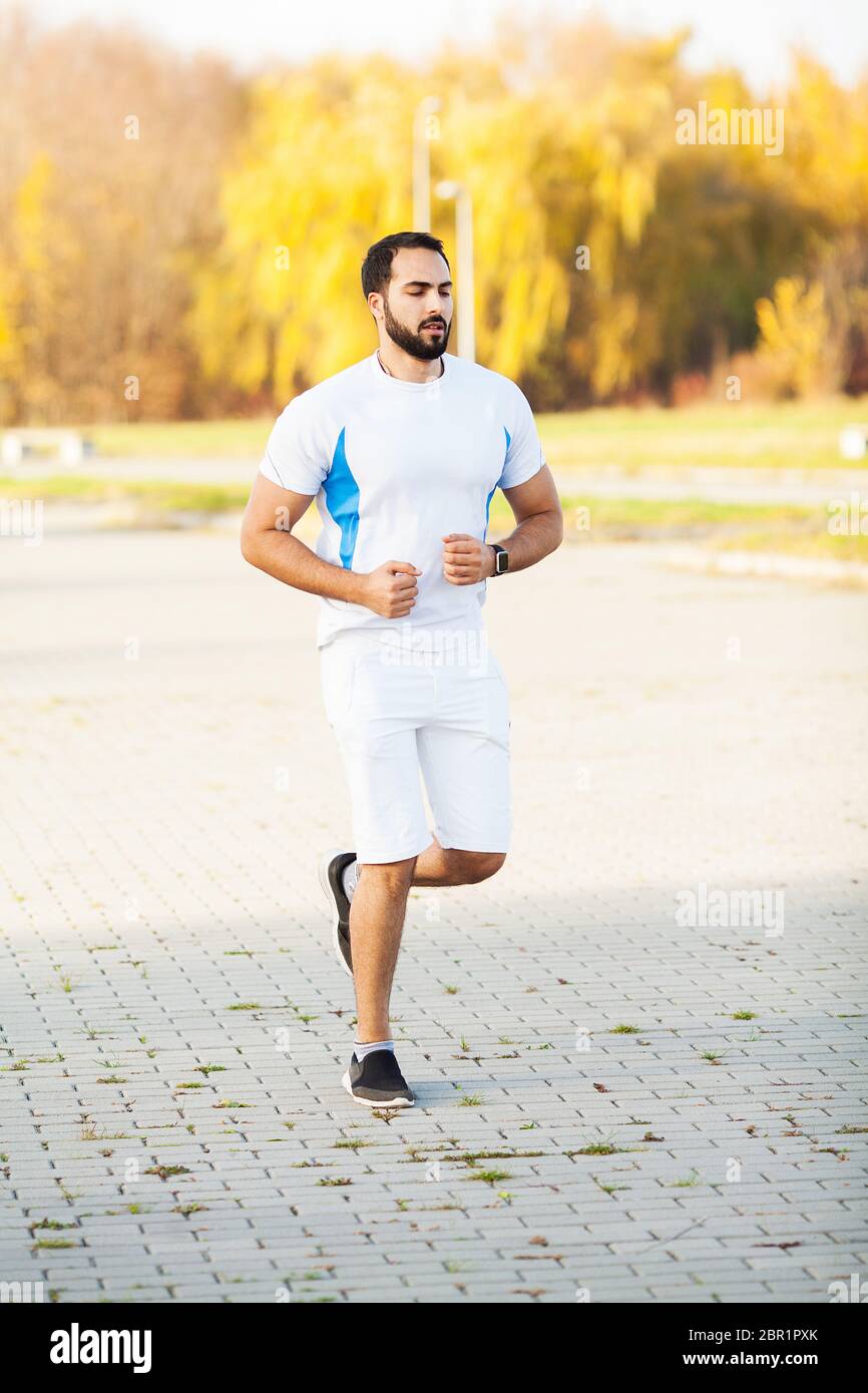 Fitness. Stretch man doing stretching exercise. Standing forward bend ...