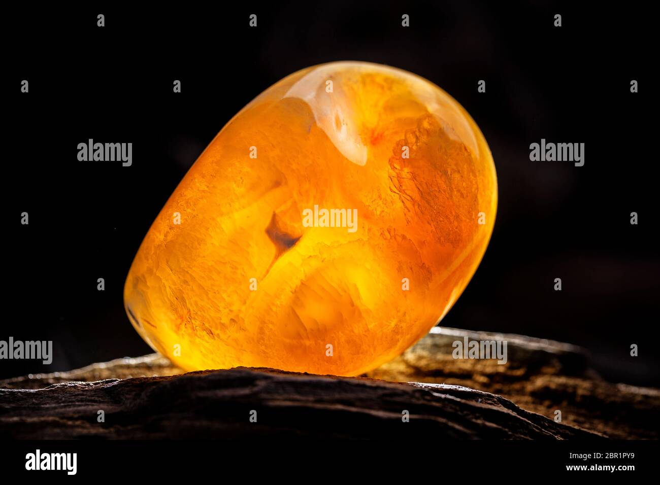 A piece of yellow semi opaque natural amber, classification color ...