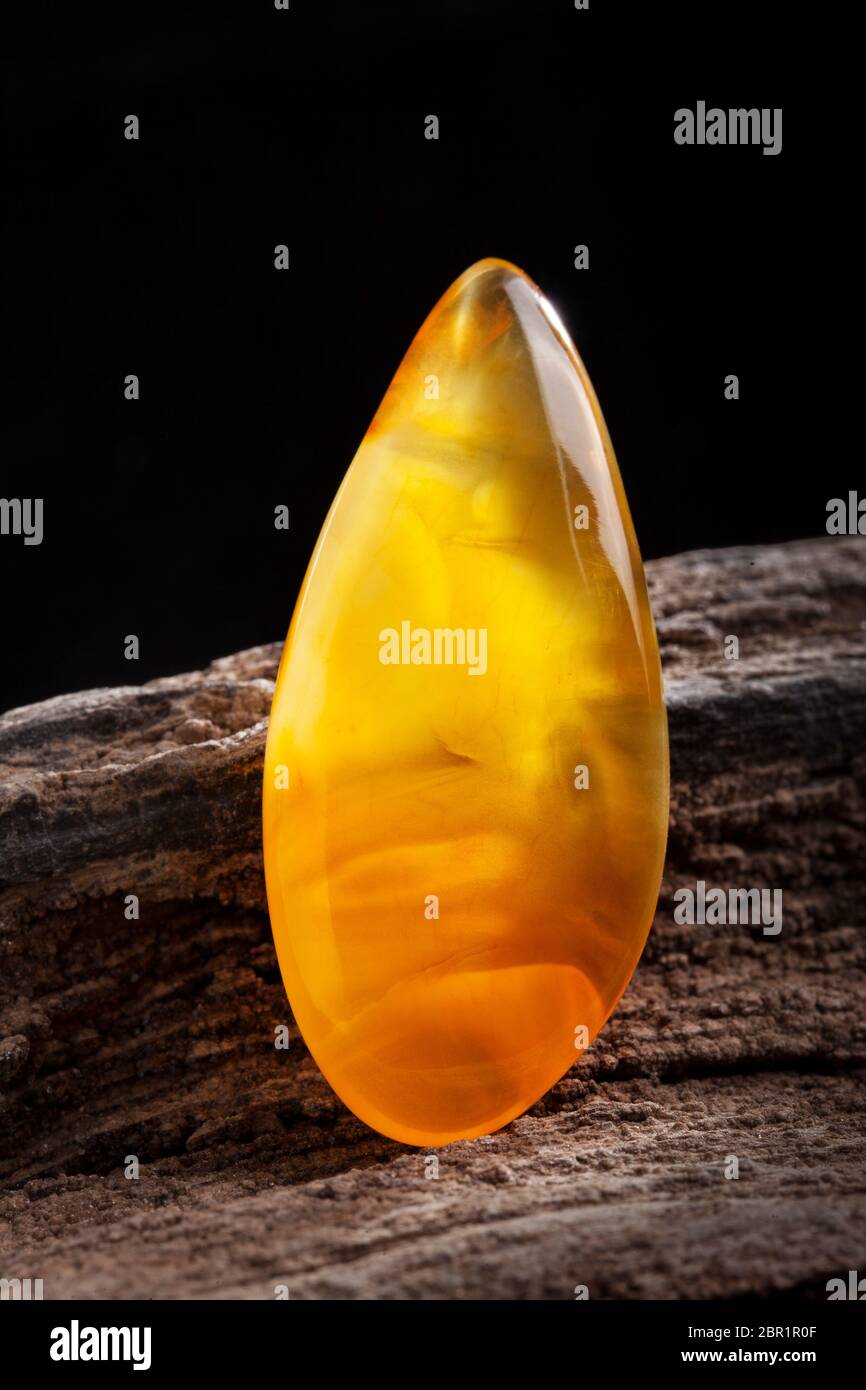 A piece of yellow semi opaque natural amber, classification color ...