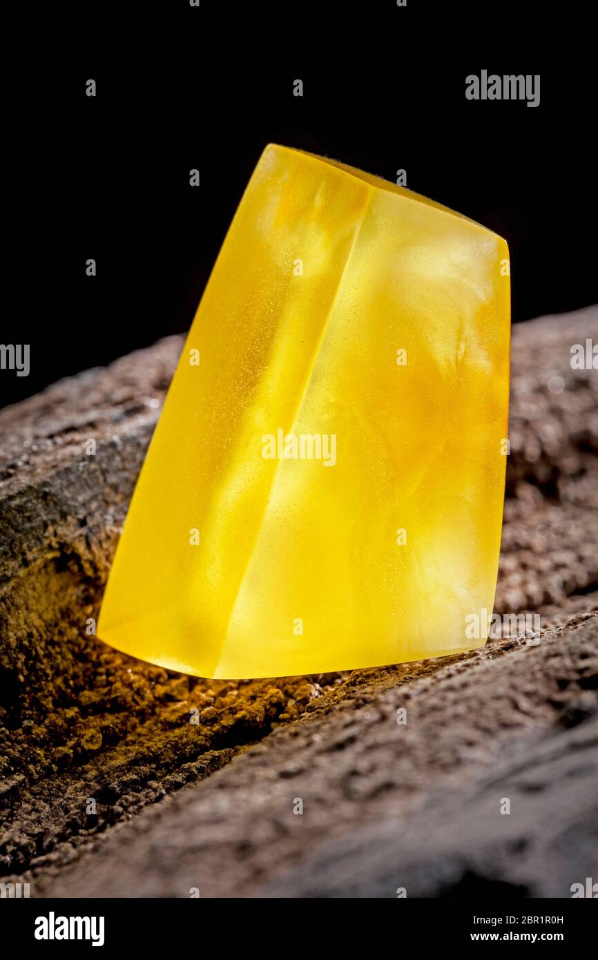 A piece of yellow semi opaque natural amber, classification color ...