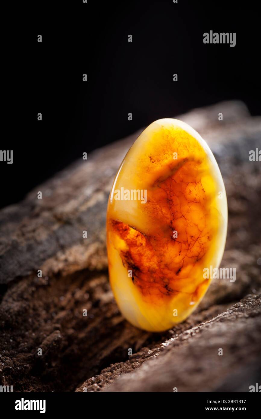 A piece of yellow semi opaque natural amber, classification color ...