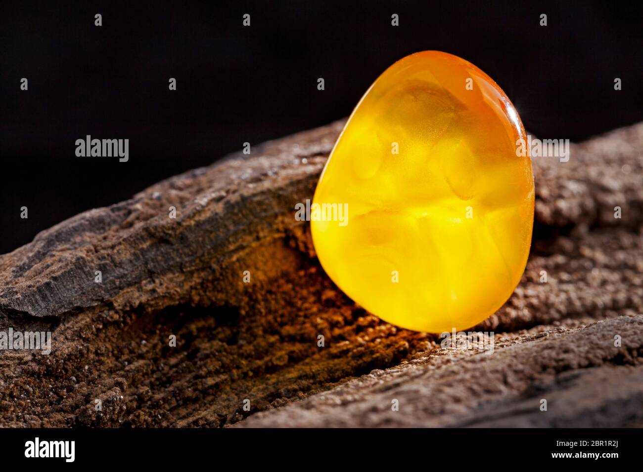 A piece of yellow semi opaque natural amber, classification color ...