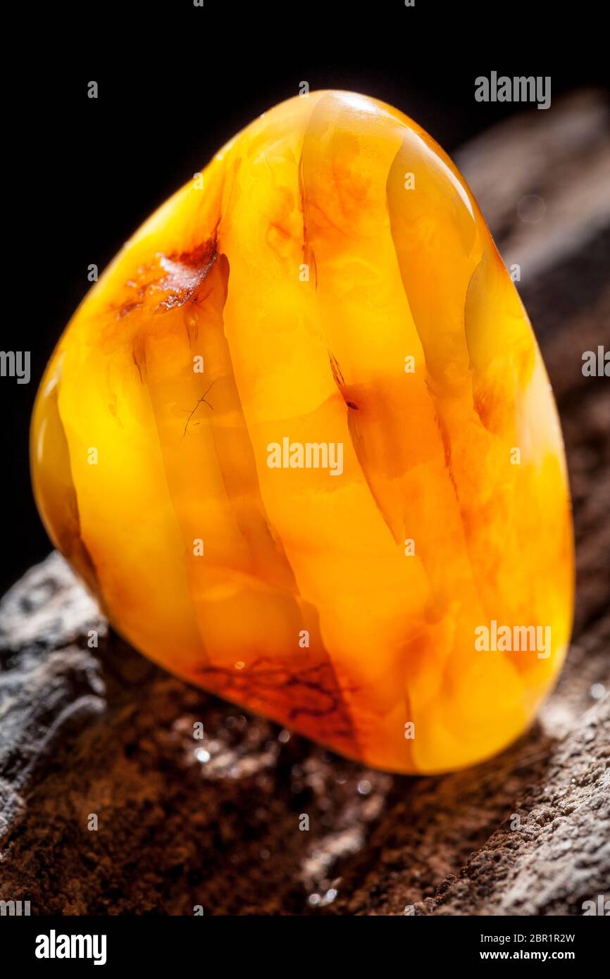 A piece of yellow semi opaque natural amber, classification color ...