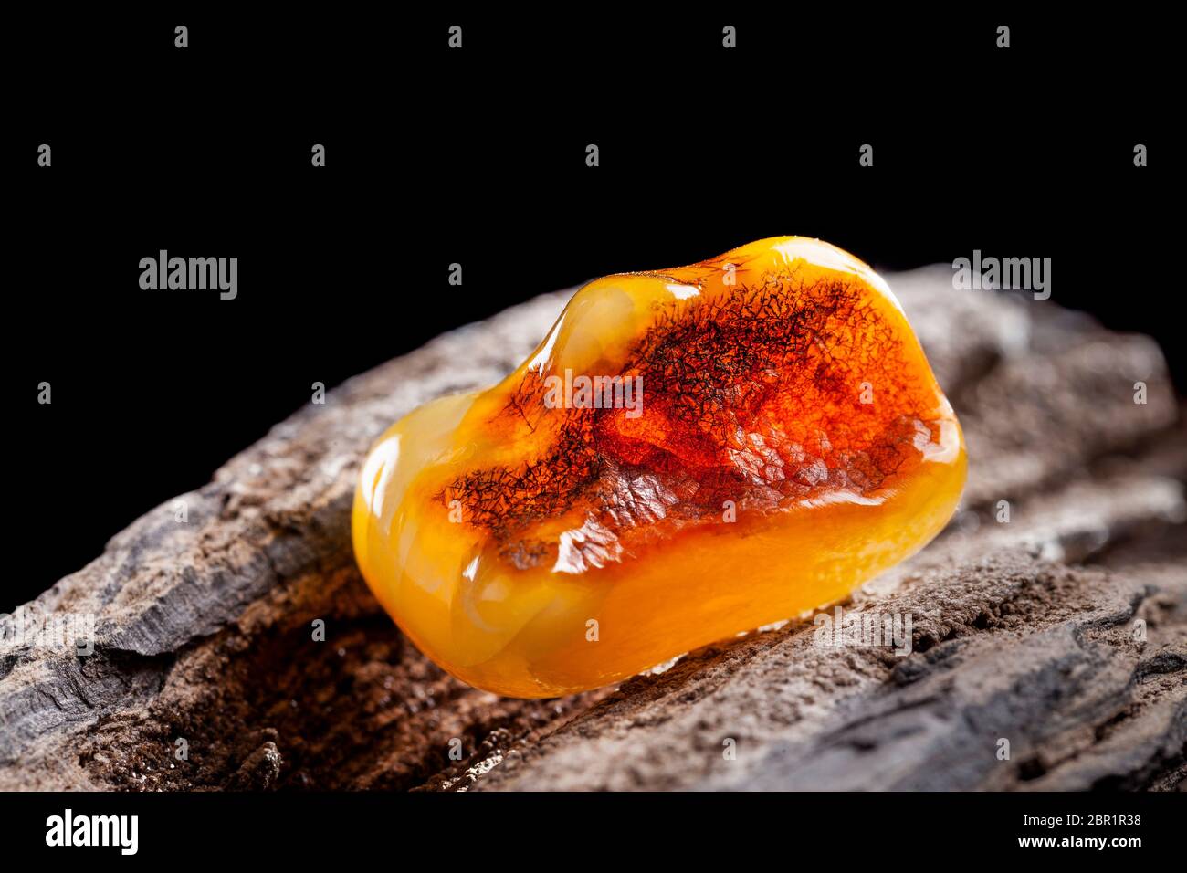 A piece of yellow semi opaque natural amber, classification color ...