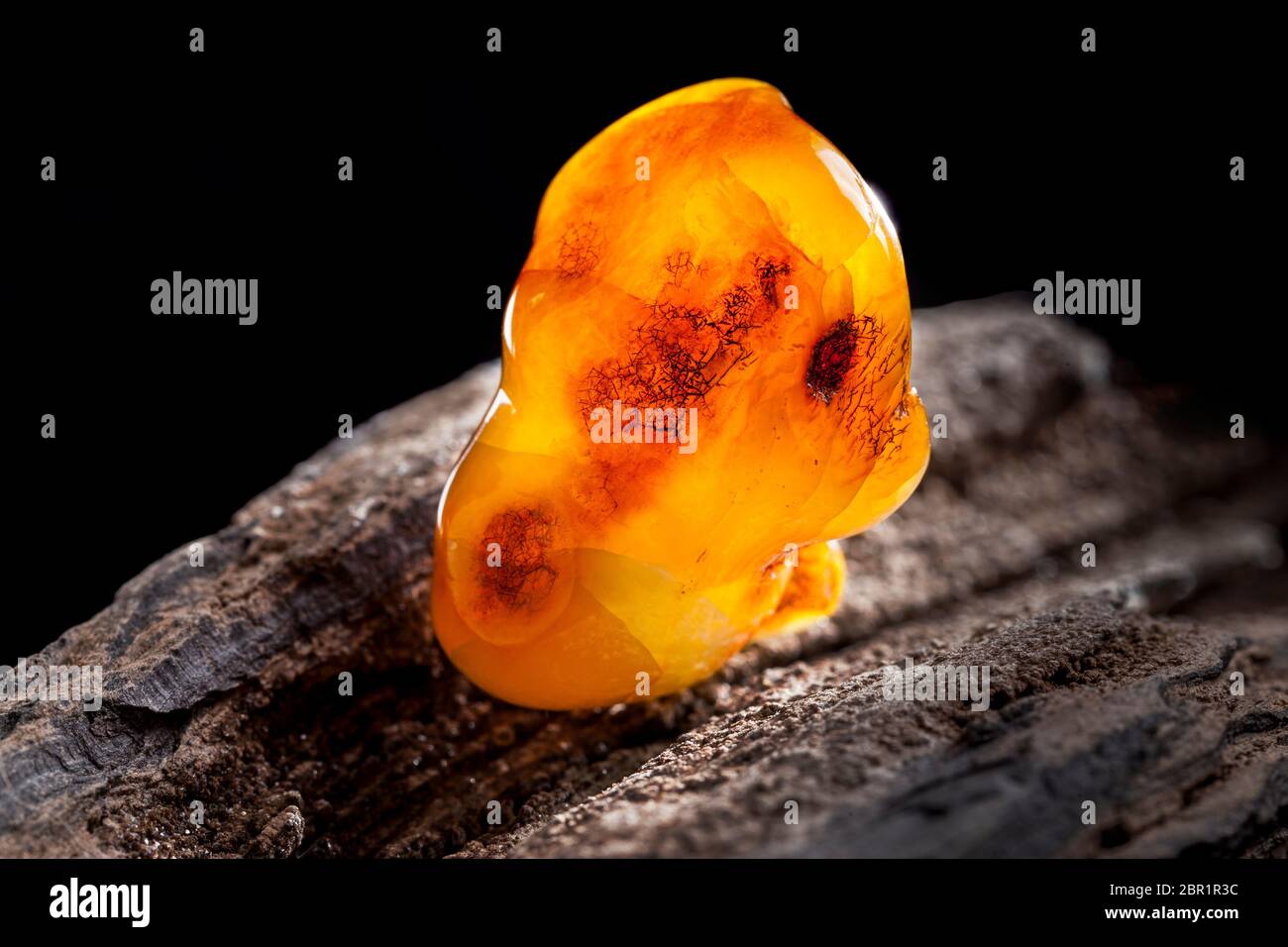 A piece of yellow semi opaque natural amber, classification color ...