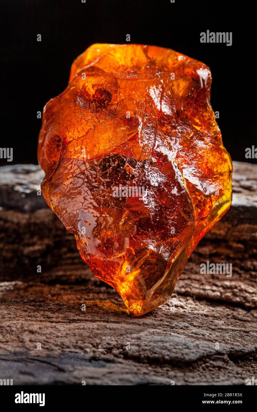 A piece of yellow semi transparent natural amber, classification color ...