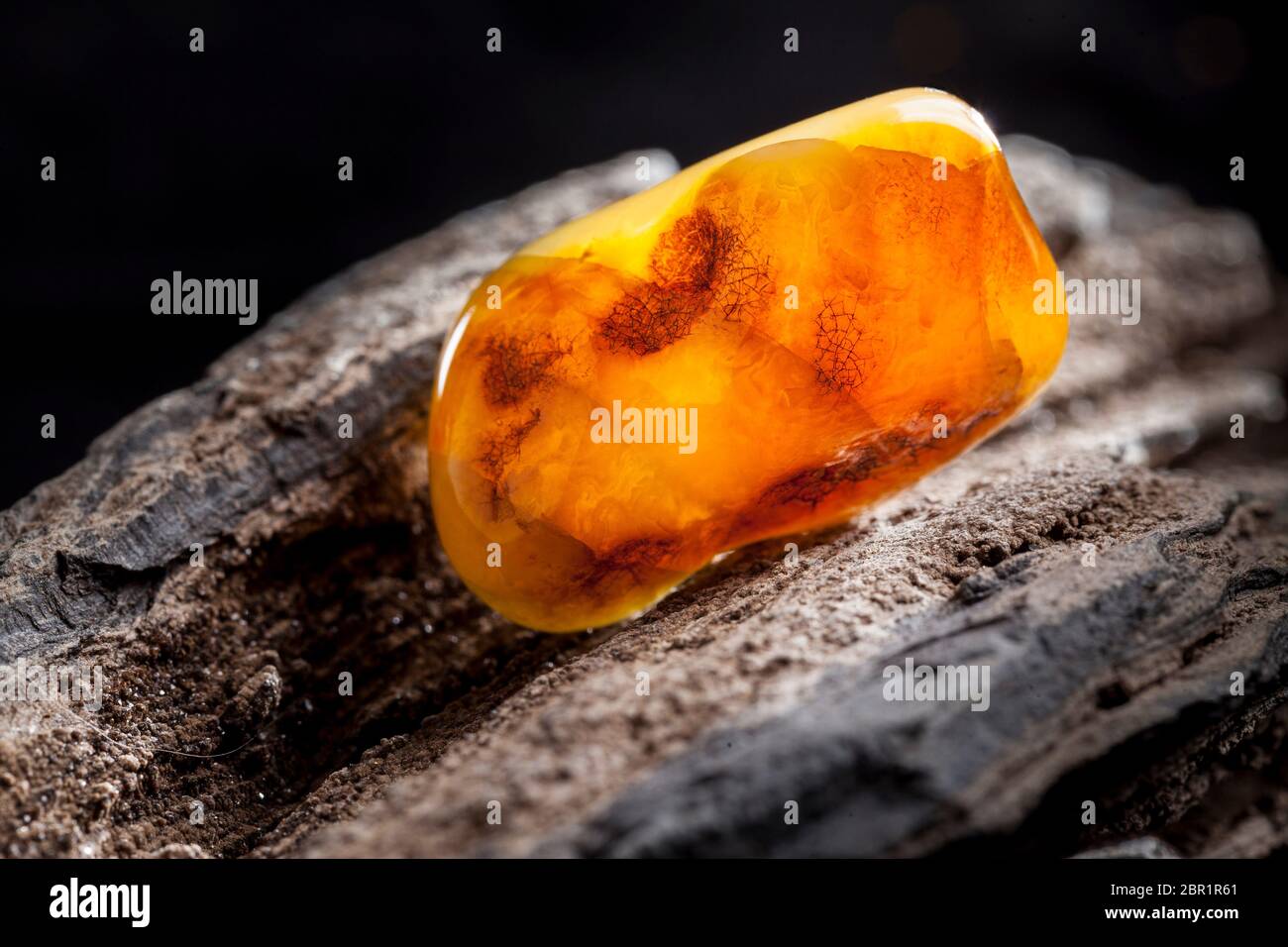 A piece of yellow semi opaque natural amber, classification color ...