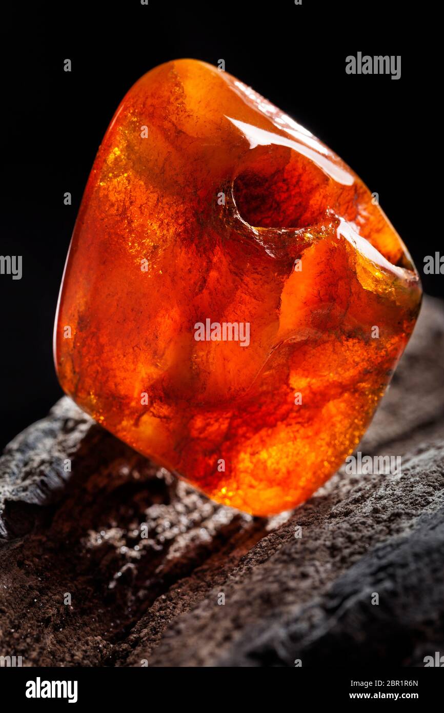 A piece of yellow semi transparent natural amber, classification color ...