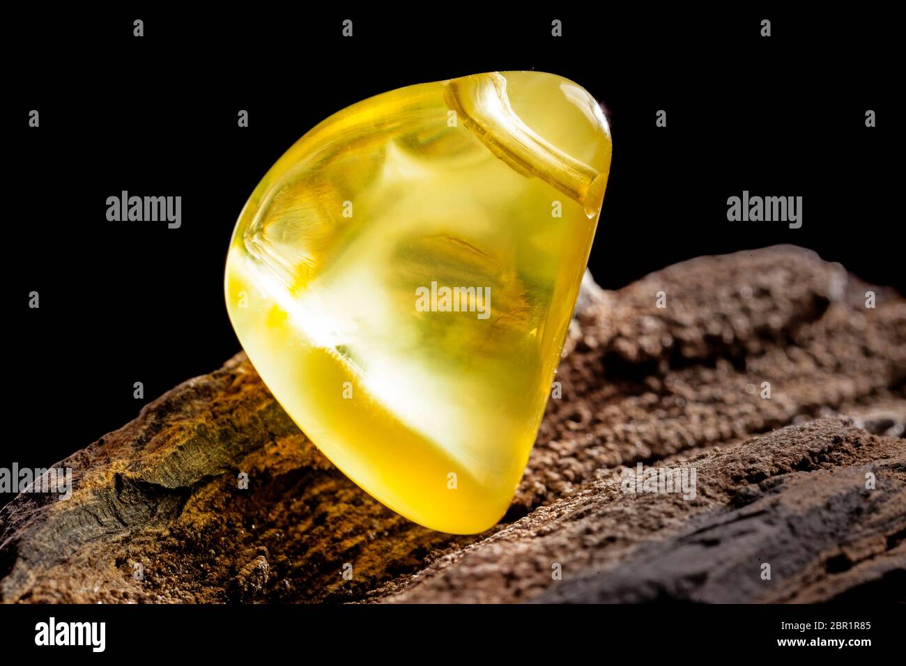 A piece of yellow semi opaque natural amber, classification color ...