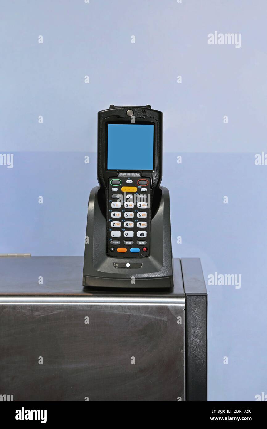 Handheld Laser Barcode Reader and Scanner at Charger Dock Stock Photo ...