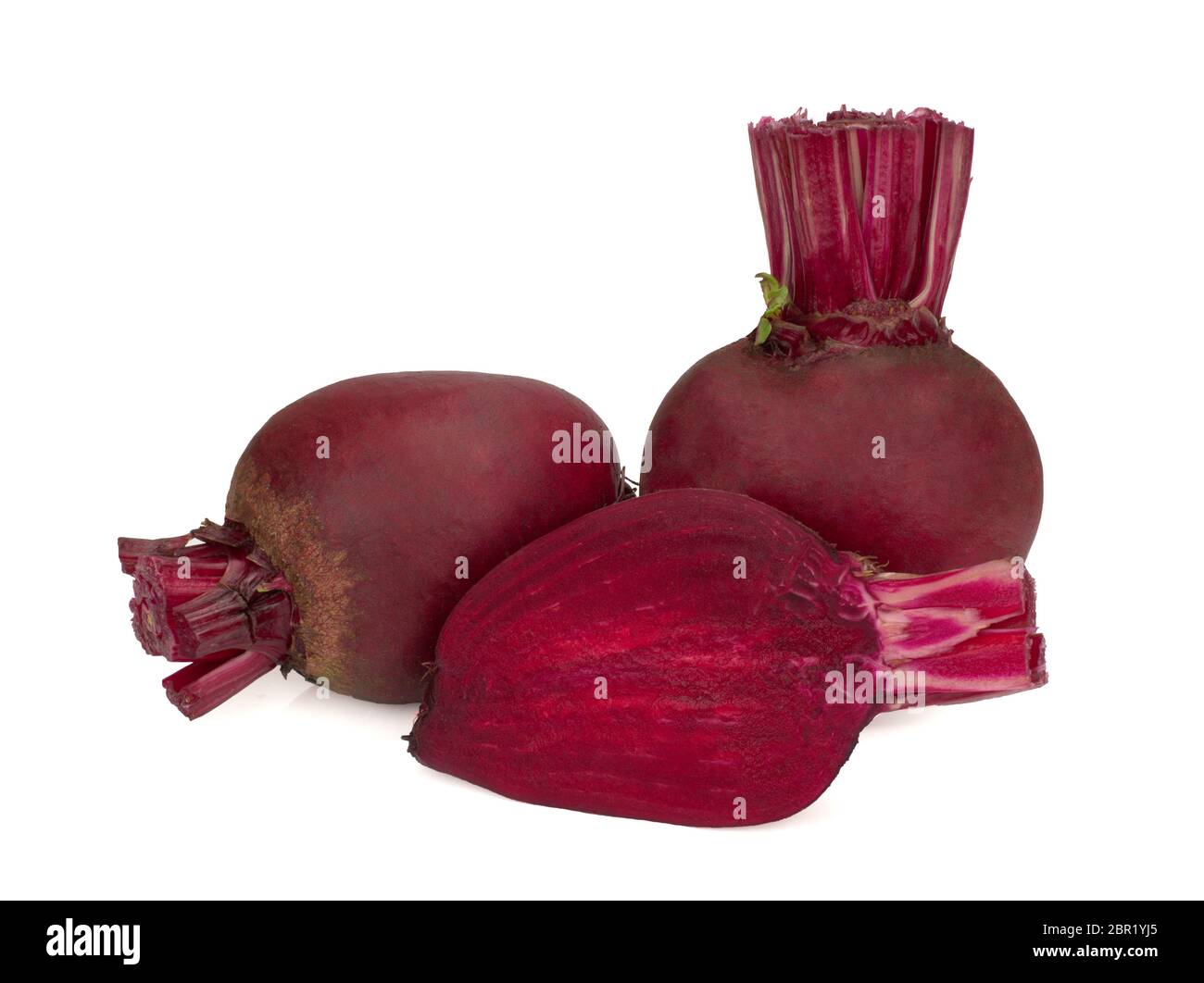 Whole red beetroots and a half isolated on white background Stock Photo ...