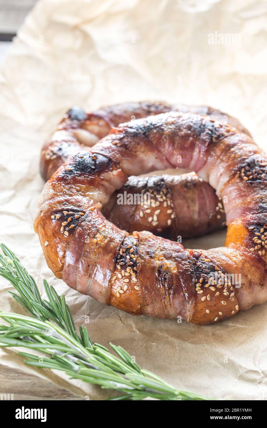 Bagels with sesame wrapped in bacon rashers Stock Photo - Alamy