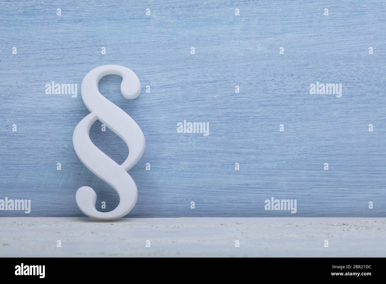 Close-up Of A Paragraph Symbol Leaning On Blue Wall Stock Photo - Alamy