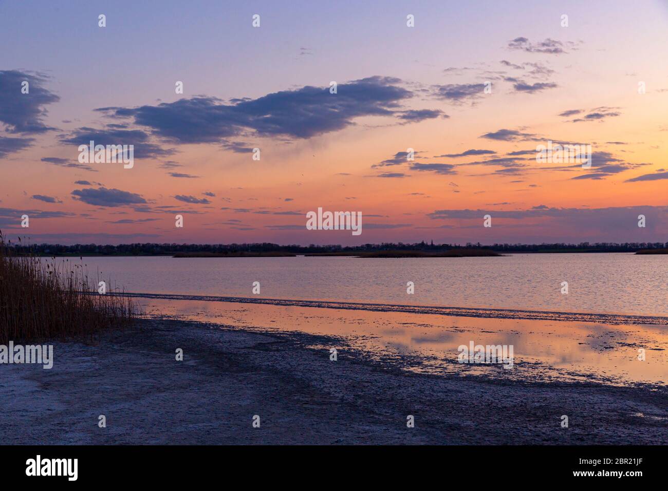 Nice sunset scene over lake Stock Photo - Alamy