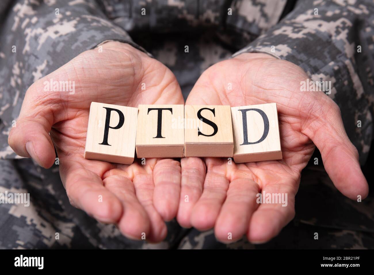 Close-up Of Male Soldier In Military Uniform Holding Wooden Cubes With ...
