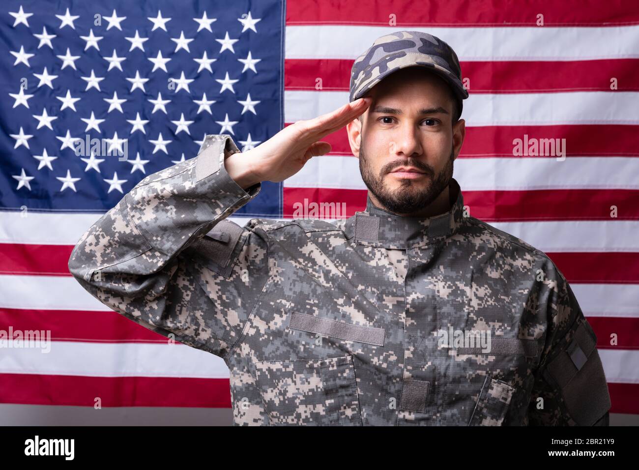 Portrait Of A Male Solider Saluting Against The American Flag Stock ...