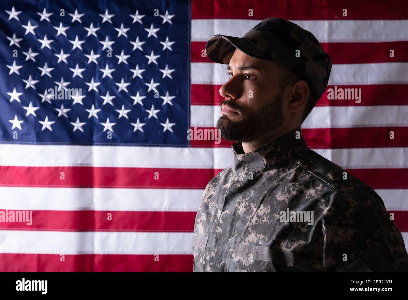 Close-up Of Male Solider Standing In Front Of An Us Flag Stock Photo ...