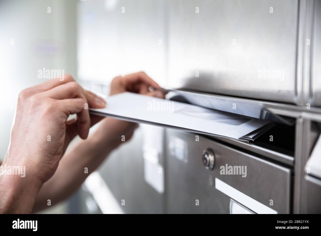 Close-up Of Human's Hand Inserting Letters In Mailbox Stock Photo - Alamy