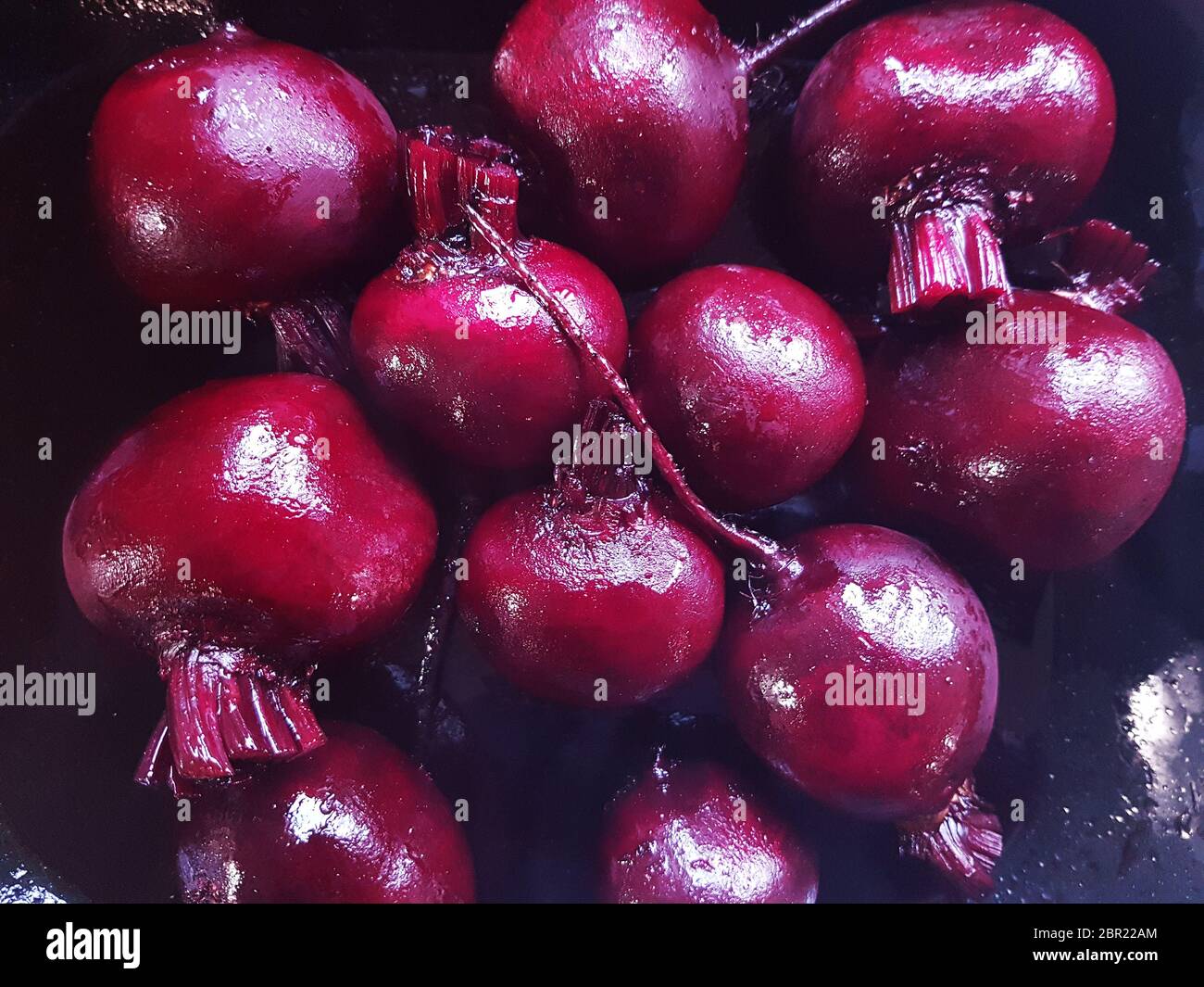 Oven roasted whole baby beetroot in a pan Stock Photo - Alamy