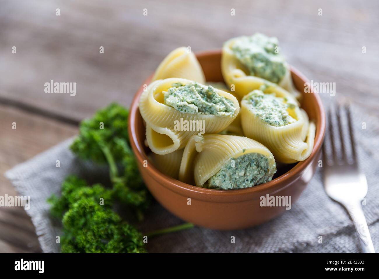 Stuffed lumaconi with cheese Stock Photo - Alamy