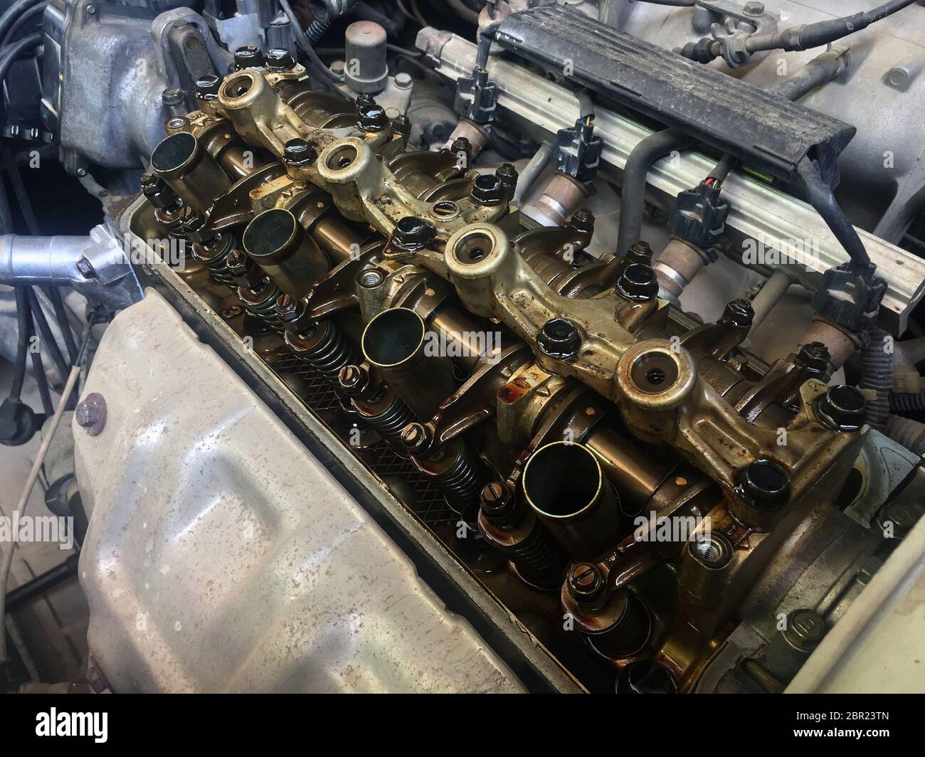 Closeup of parts in the engine, camshaft head and valve system In the ...