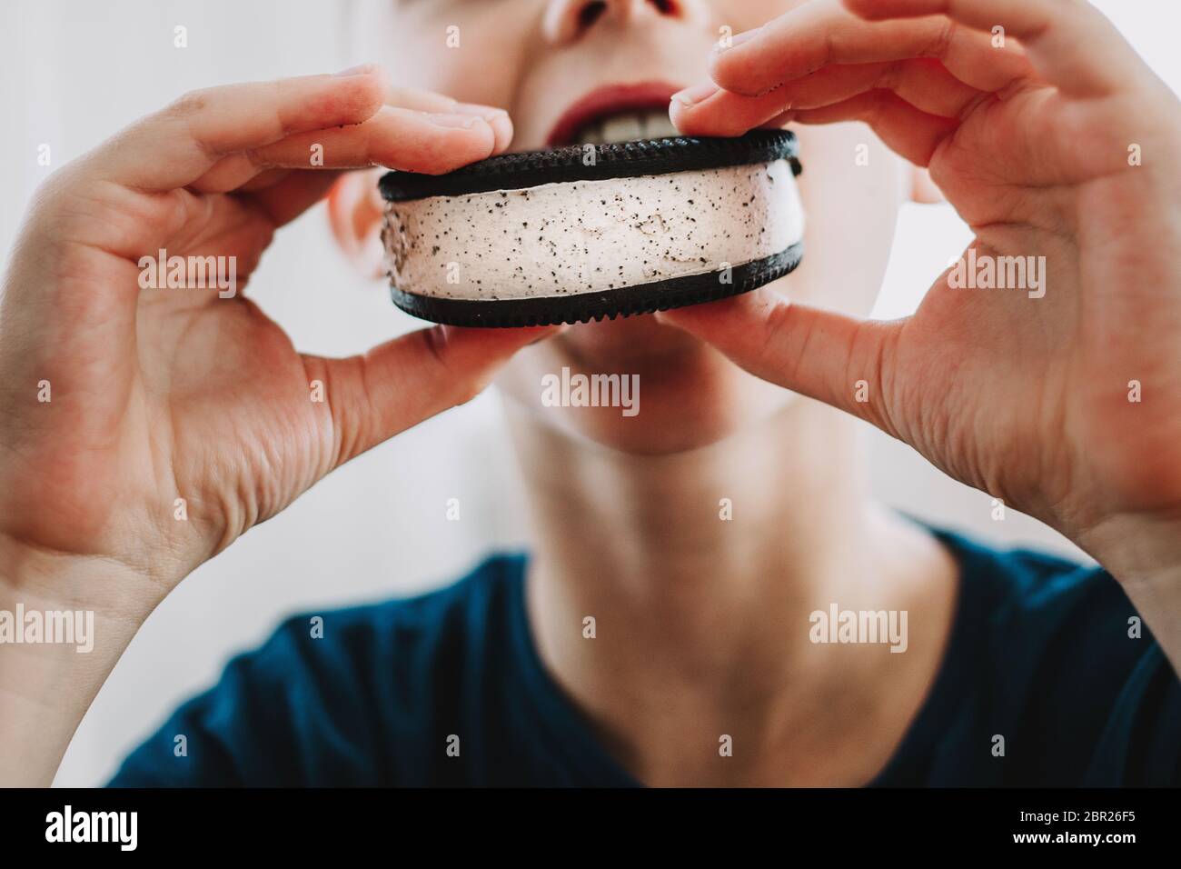 Boy Eating Ice Cream Sandwich High Resolution Stock Photography and ...