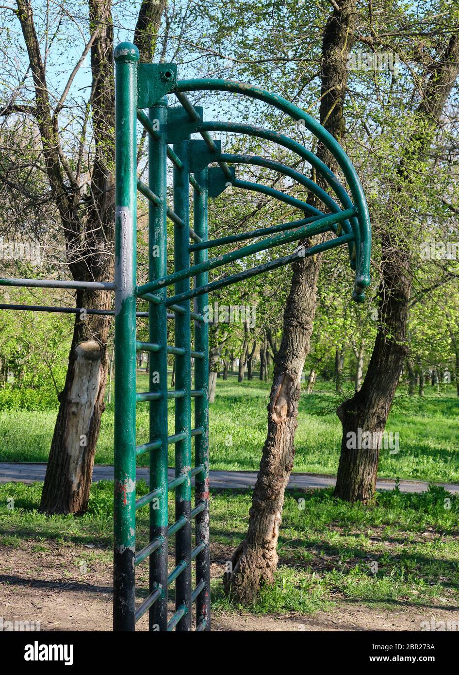 metal horizontal bar for sports in the park, day Stock Photo - Alamy