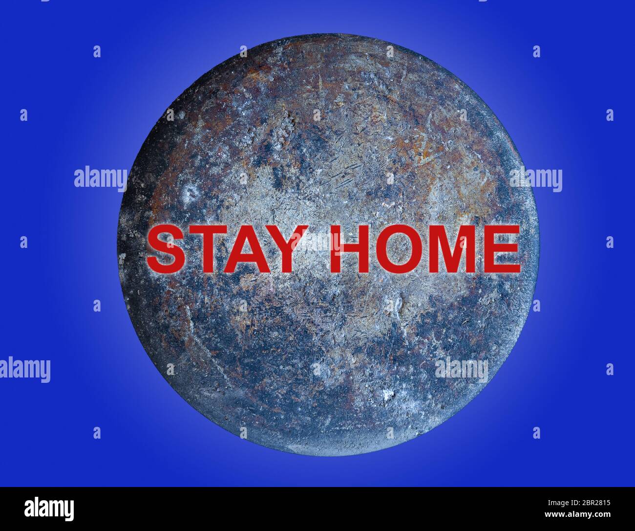 The inscription in red STAY HOME over the planet Earth on a blue ...