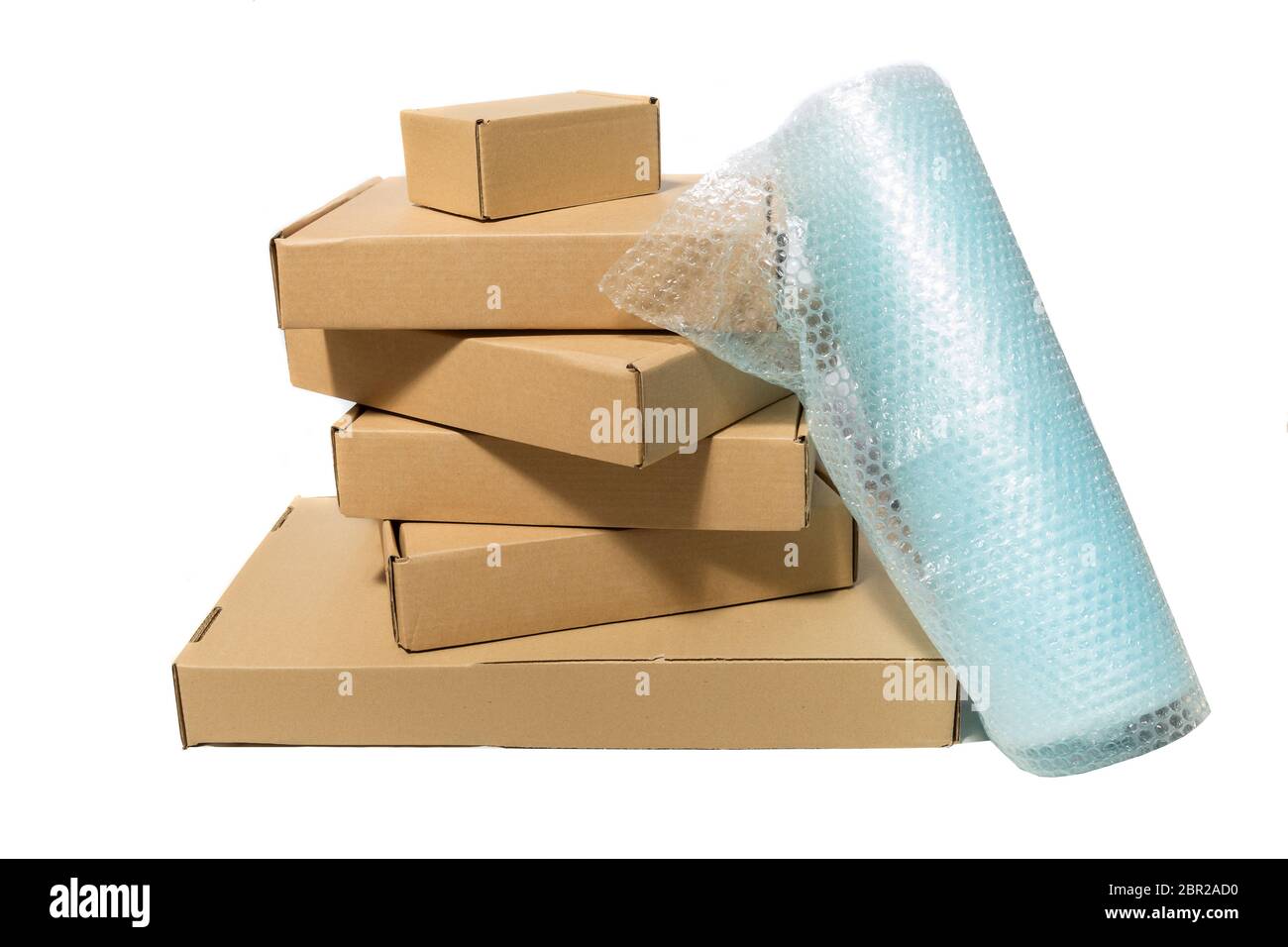 pile of various size boxes and bubble packing material Stock Photo - Alamy
